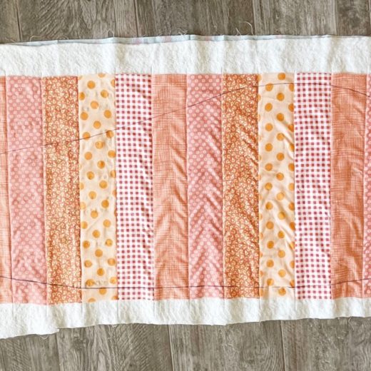 Scrappy Quilted Carrot Table Runner for Spring